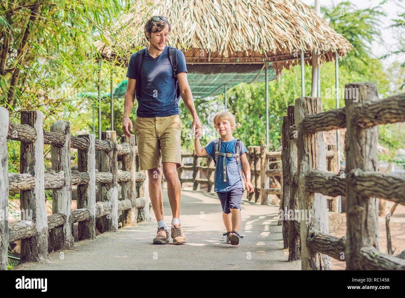 Father and son at the zoo. Spending day with family at the zoo Stock ...