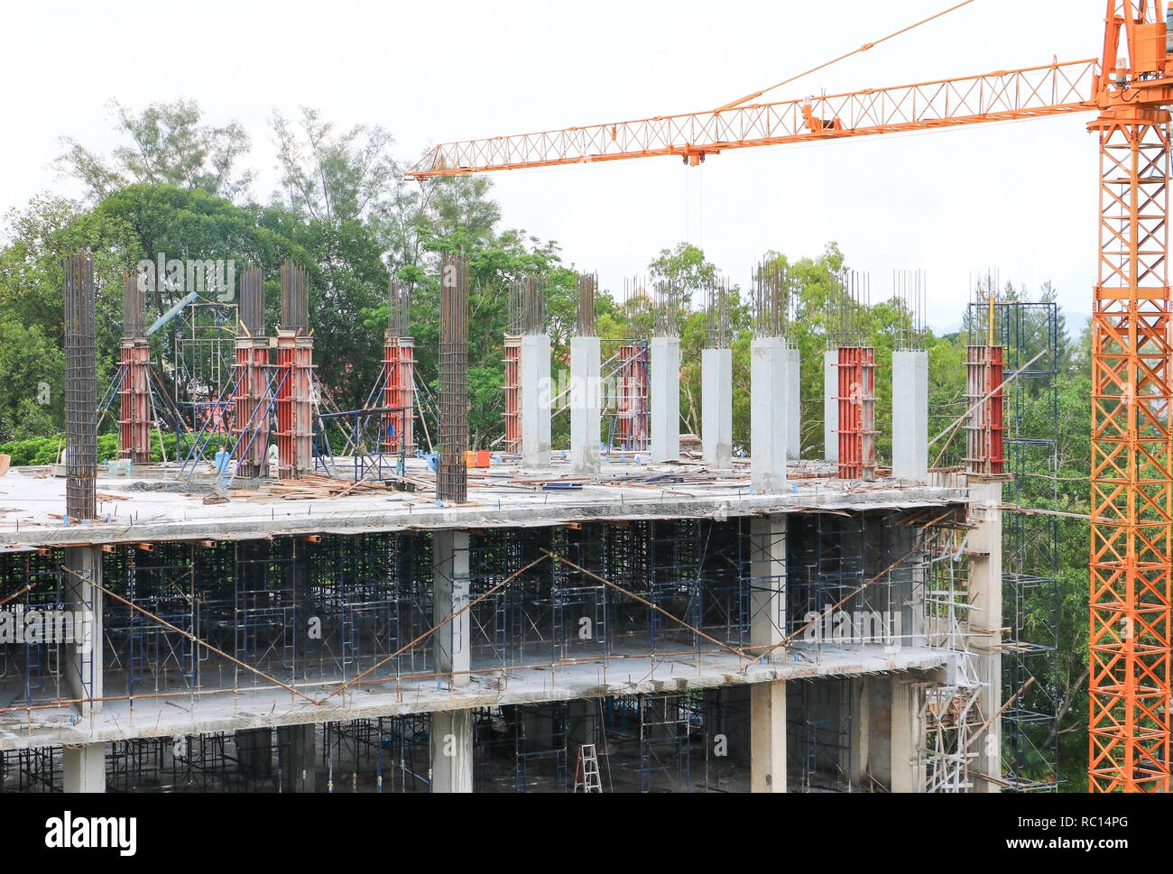 labor working and Crane hook in big construction site in develop city ...