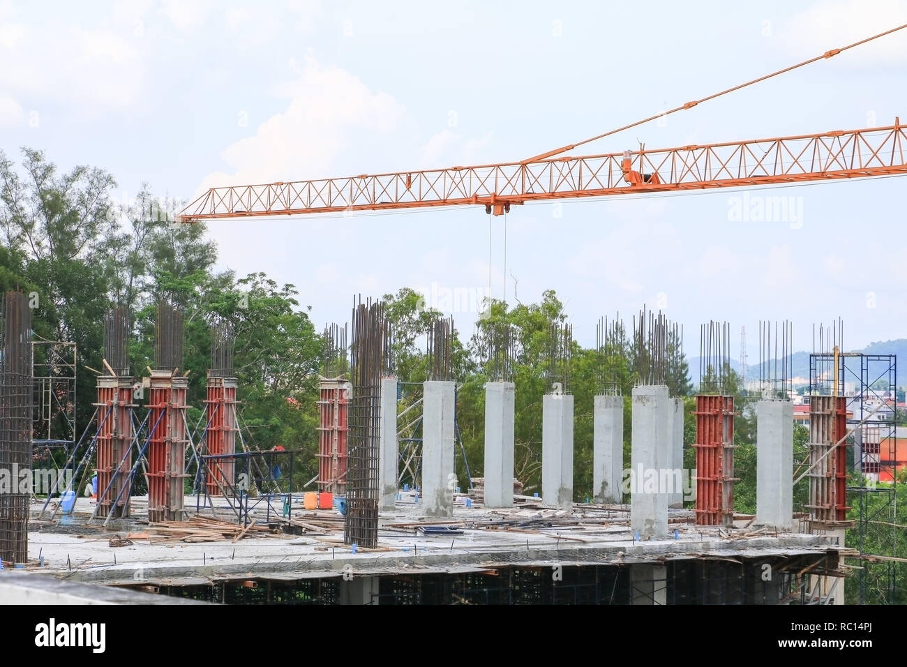labor working and Crane hook in big construction site in develop city ...