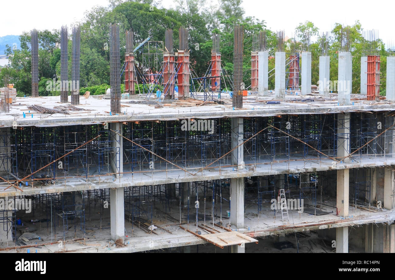 labor working and Crane hook in big construction site in develop city ...