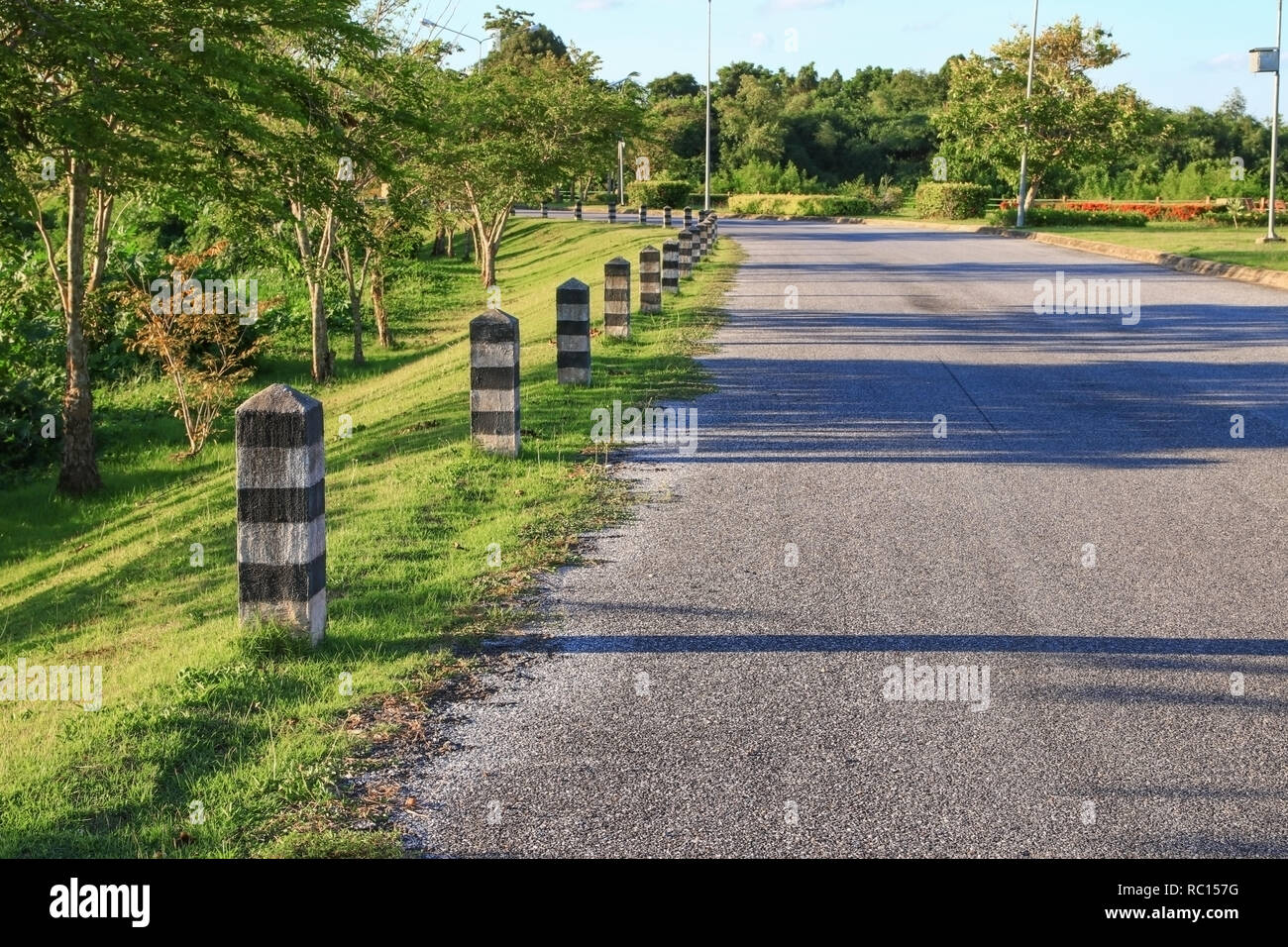 black and white painted milestone. in range roadside Stock Photo - Alamy