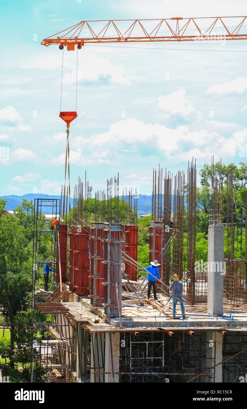 construction laborer team working on high ground building commercial in ...