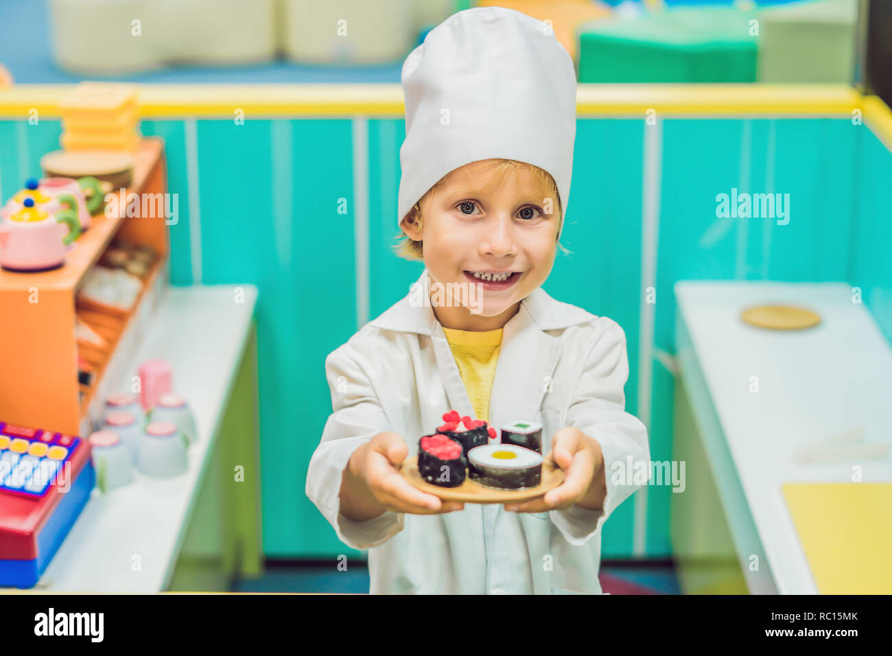 The boy plays the game as if he were a cook or a baker in a children's ...