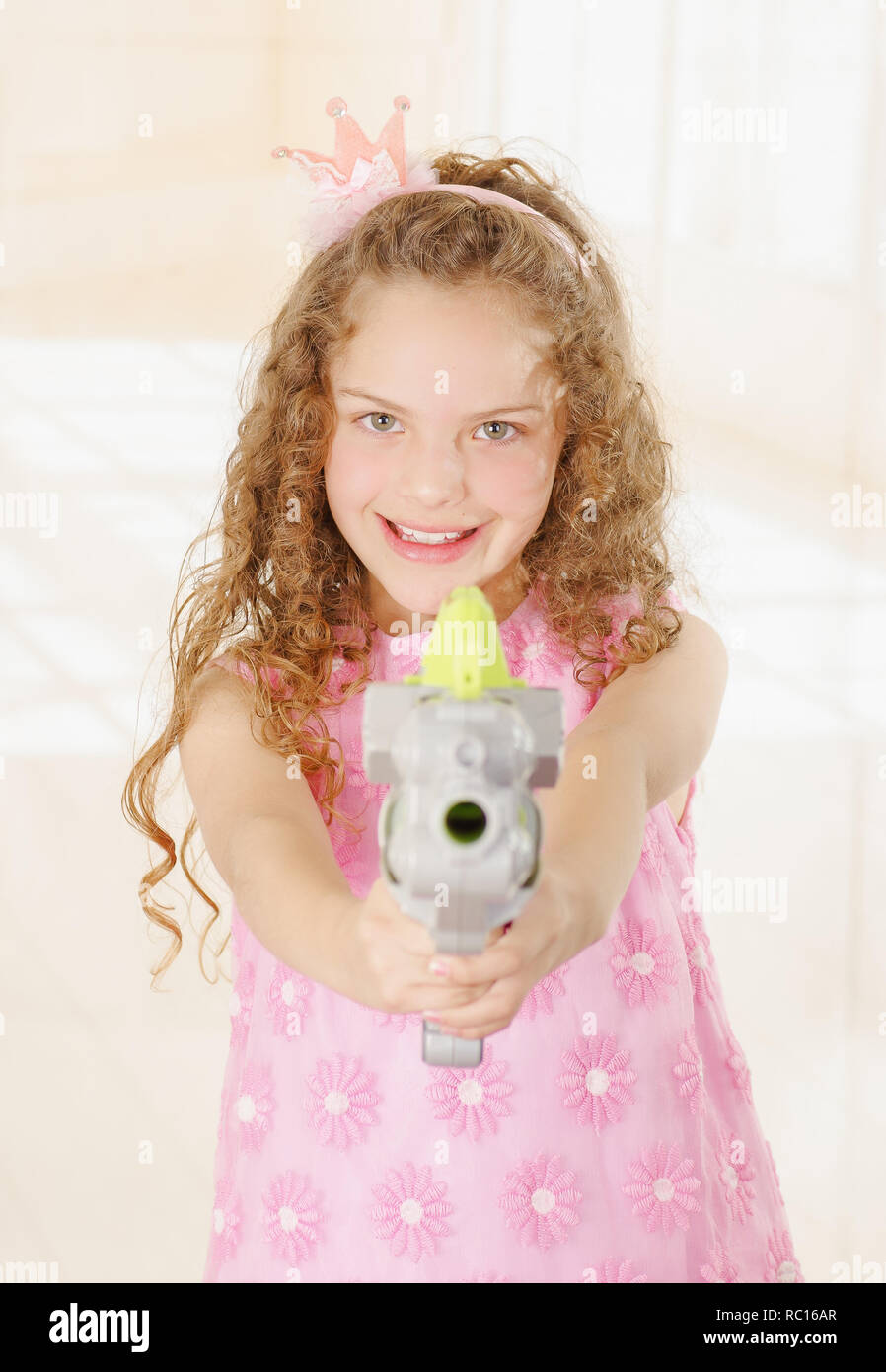 Girl pointing gun hi-res stock photography and images - Alamy
