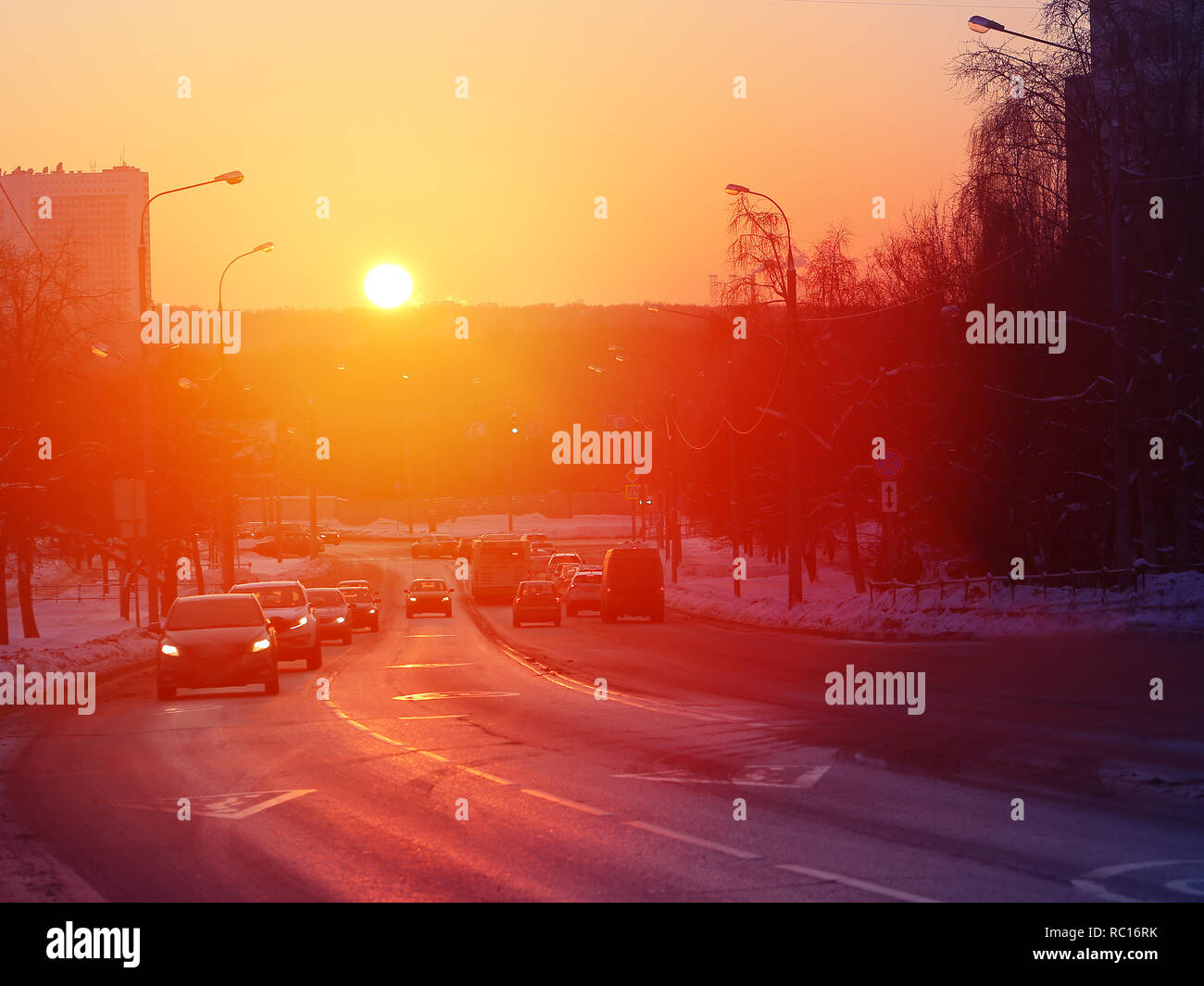Photo background of a road driving with cars at sunset Stock Photo - Alamy