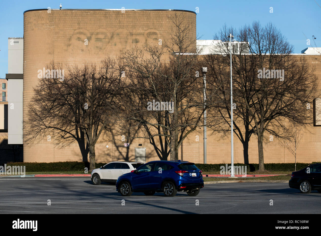 The outline of a Sears logo sign outside of a closed retail store ...