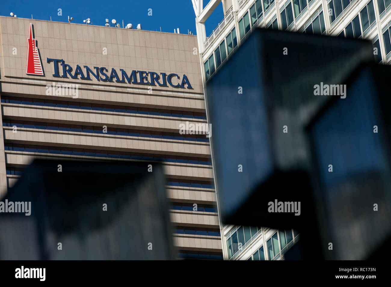 A logo sign outside of a facility occupied by The Transamerica ...