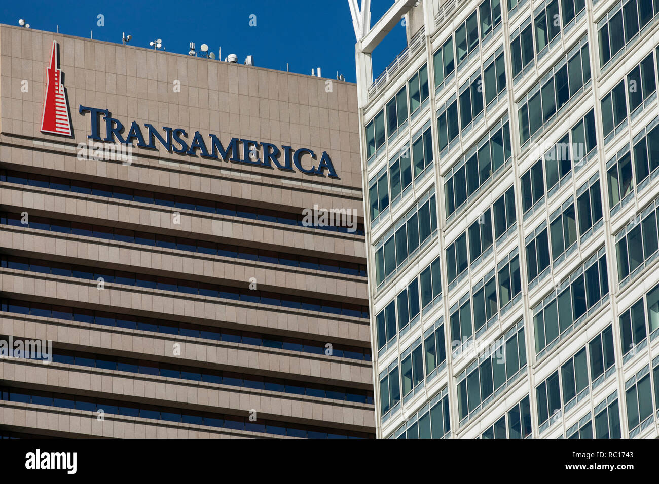 A logo sign outside of a facility occupied by The Transamerica ...