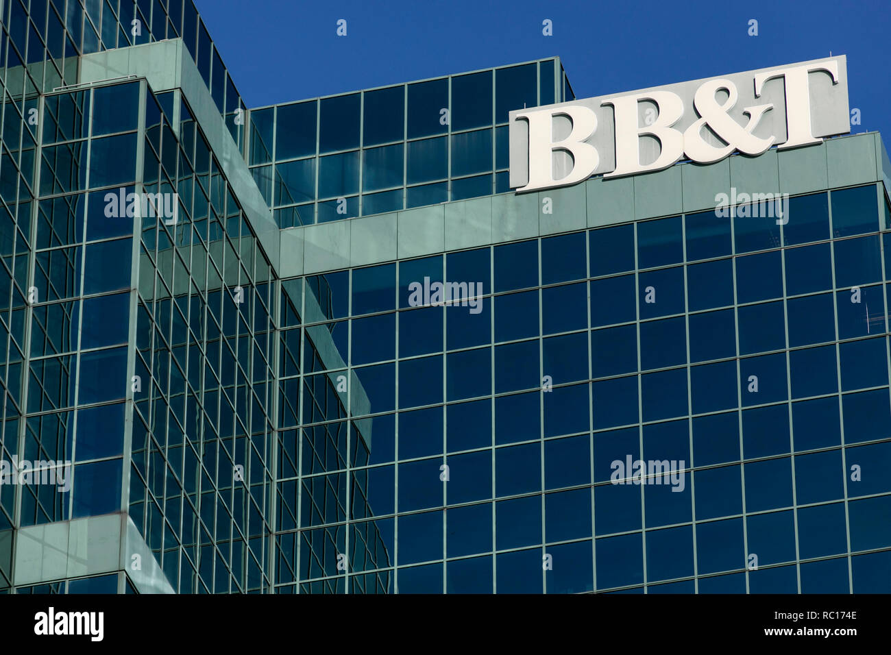 A logo sign outside of a facility occupied by BB&T Bank in Baltimore ...