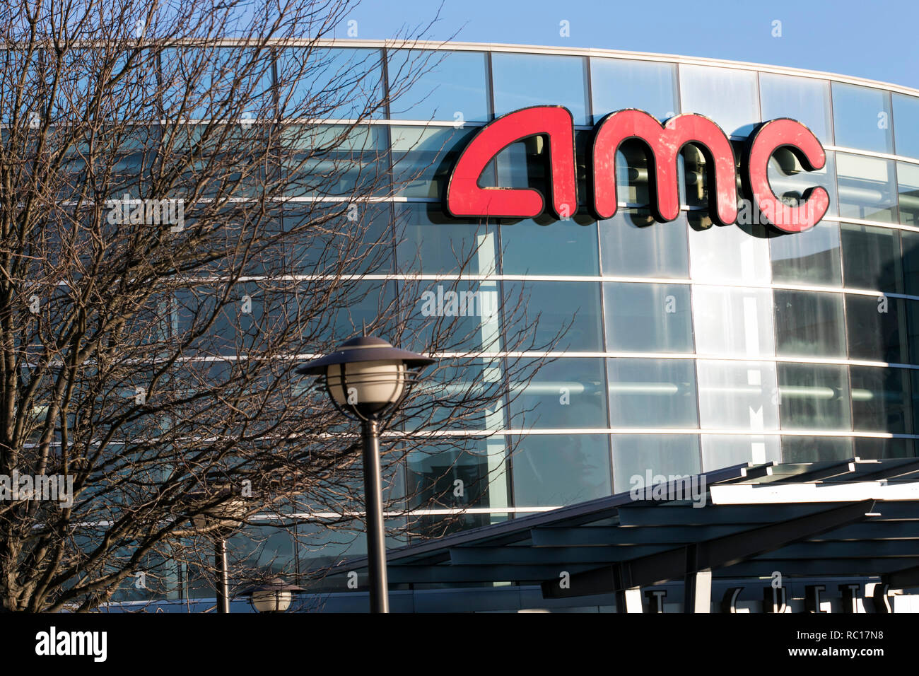 A logo sign outside of a AMC Theaters movie theater in Columbia ...