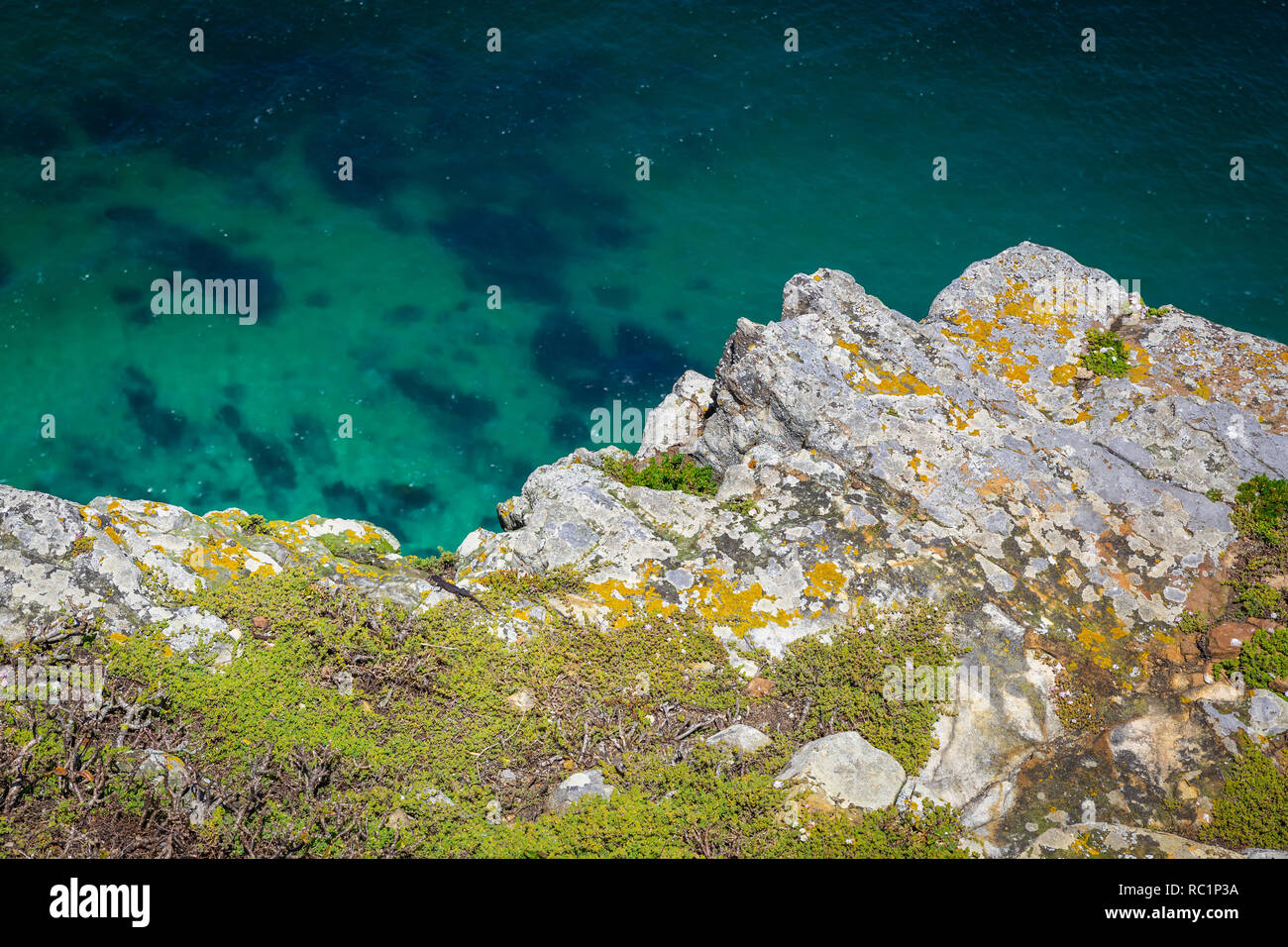 Rocky coast and emerald ocean water top view Stock Photo - Alamy