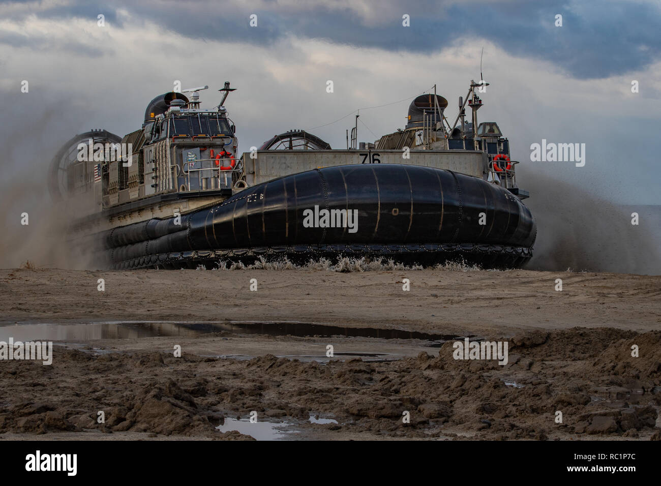 A U.S. Navy landing craft air cushion hovercraft with Assault Craft ...