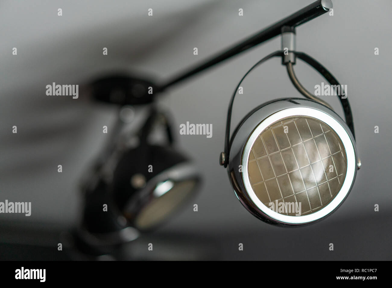 loft style iron chandelier on the ceiling, with a old motorcycle ...