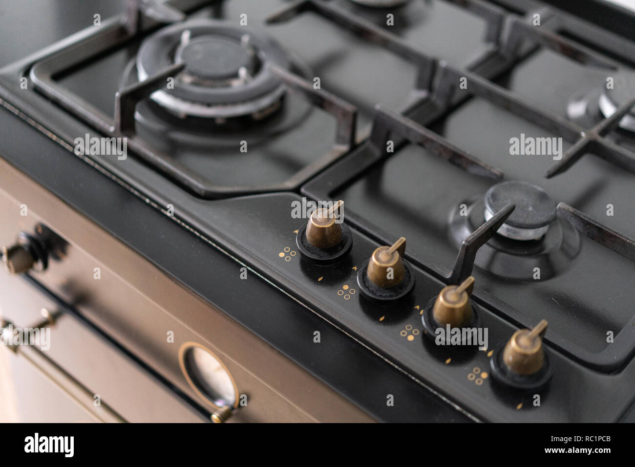 Closeup shot of blue fire from domestic kitchen hob. Gas cooker with ...