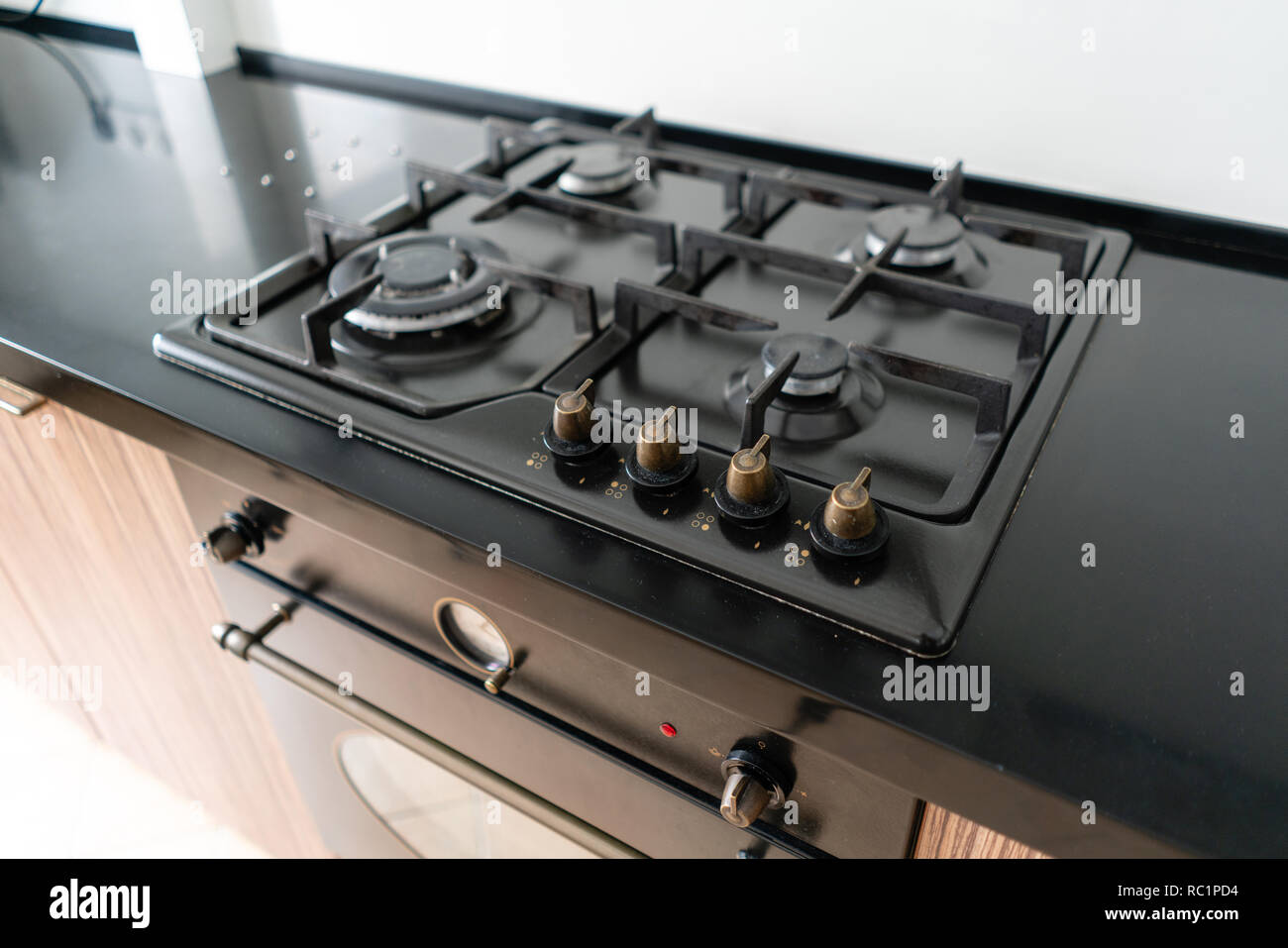 Closeup shot of blue fire from domestic kitchen hob. Gas cooker with ...