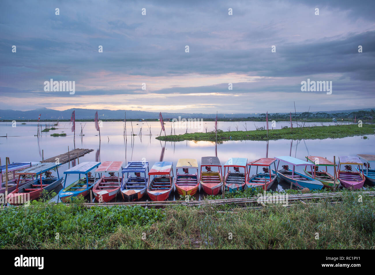 Colorful tourist boats parked at side of Rawa Pening Lake, Central Java ...