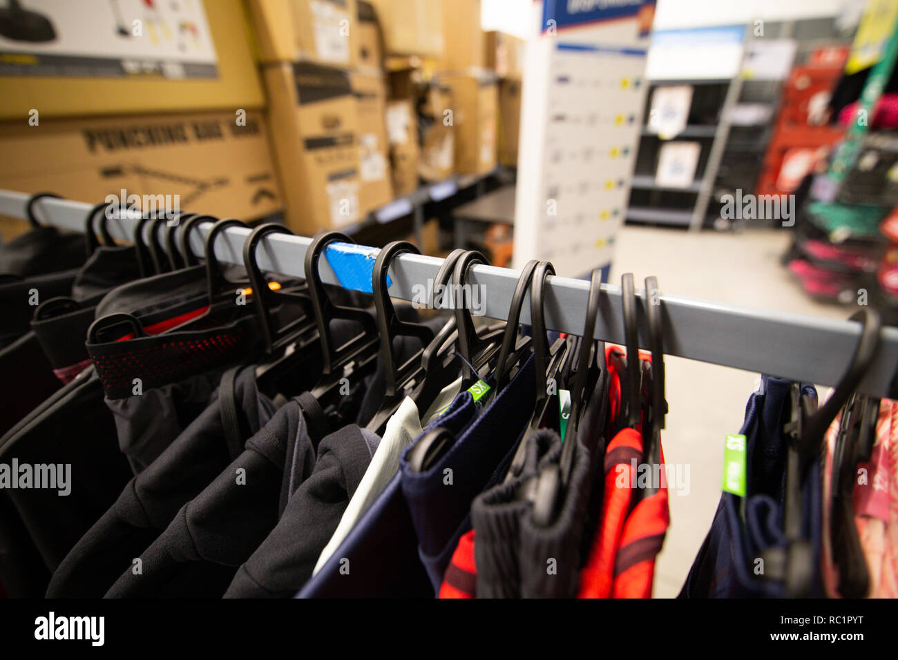Details with clothes on hangers in a clothing store inside a shopping ...