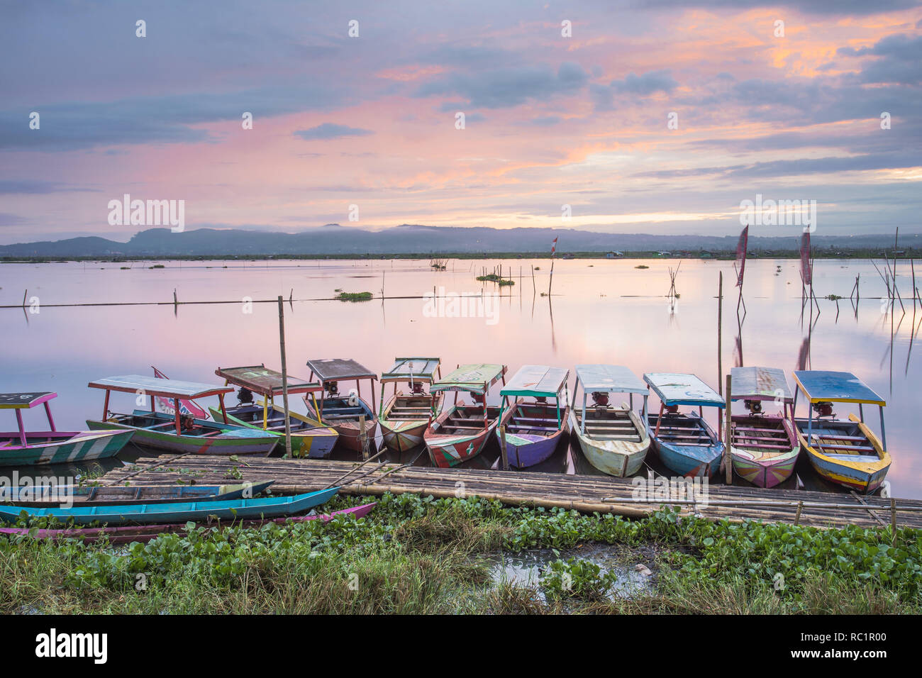 Colorful tourist boats parked at side of Rawa Pening Lake, Central Java ...