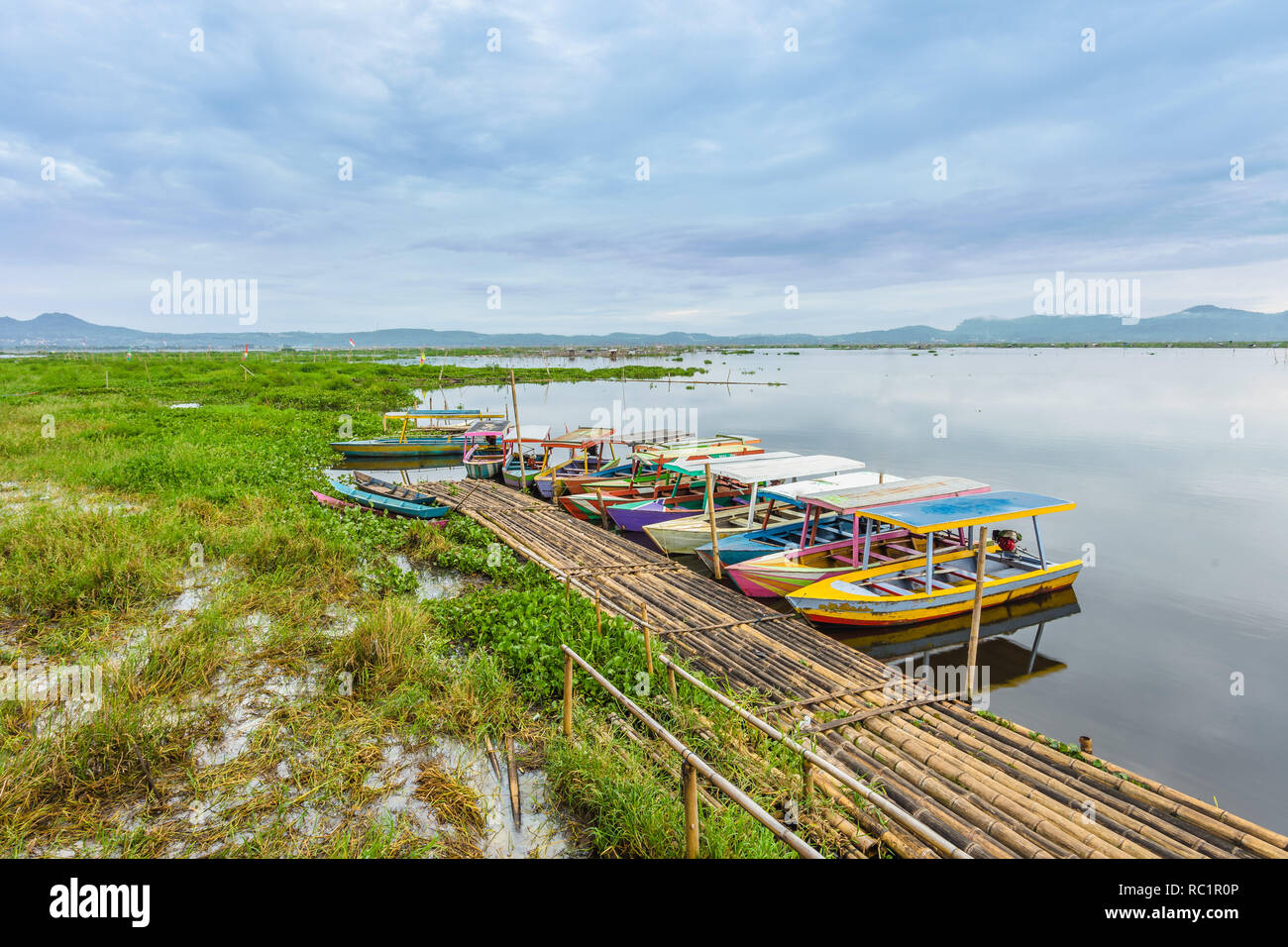 Colorful tourist boats parked at side of Rawa Pening Lake, Central Java ...