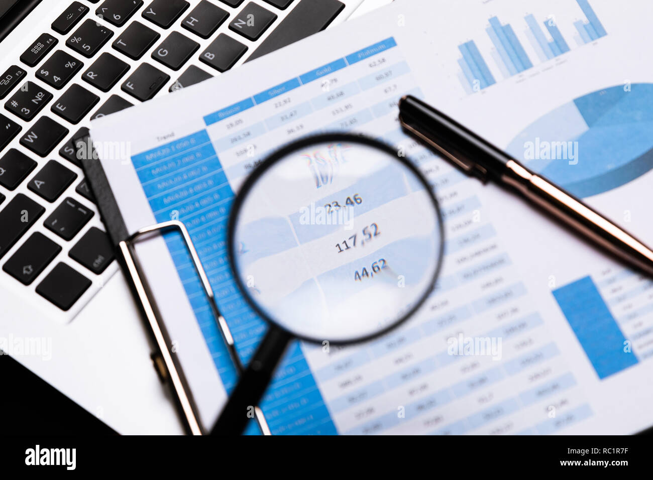 Office workplace with magnifier and stationery Stock Photo - Alamy