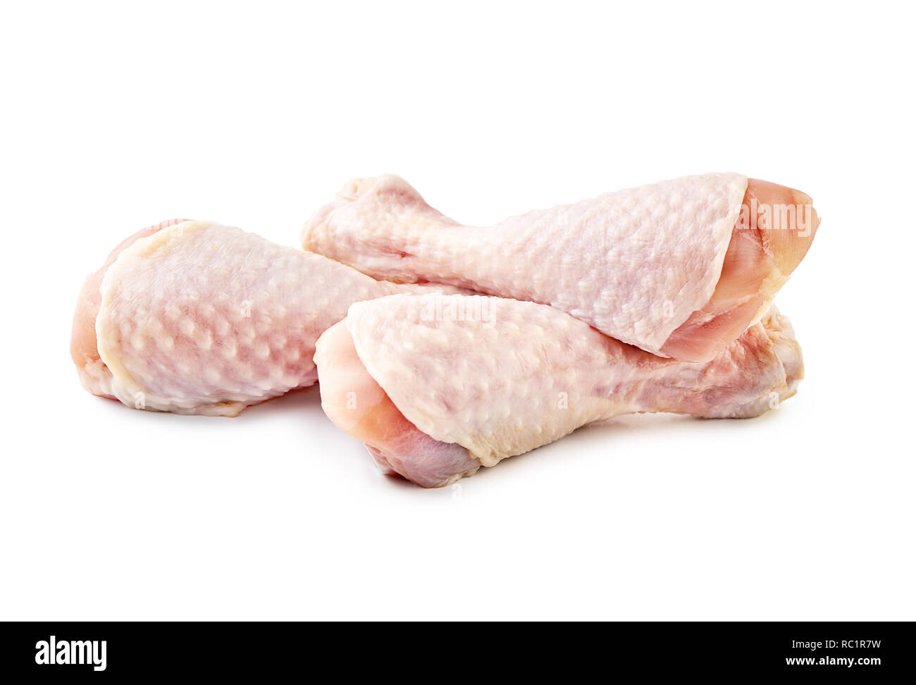 Raw chicken legs isolated on white background Stock Photo - Alamy