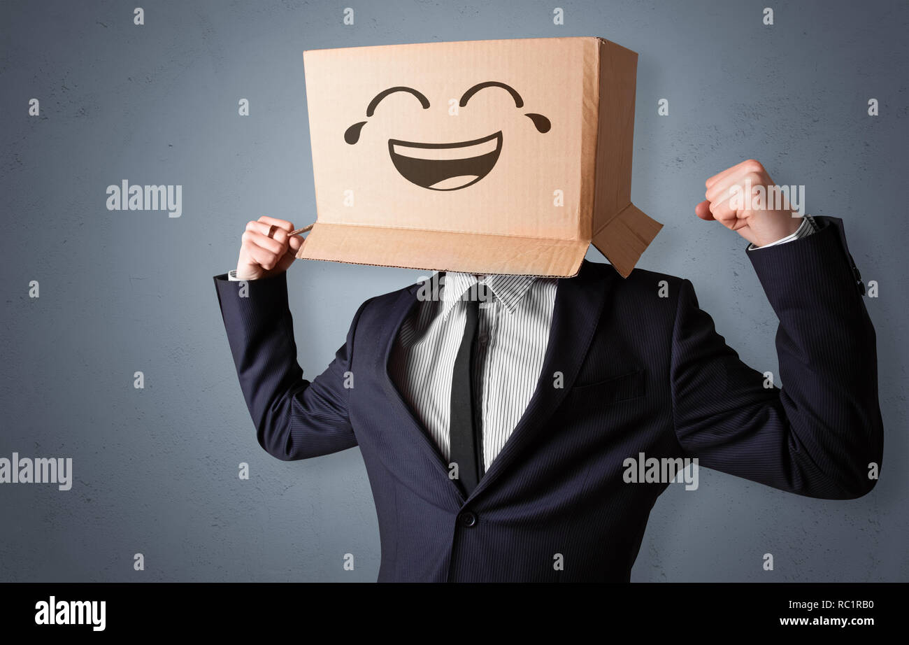 Funny man wearing cardboard box on his head with smiley face Stock ...
