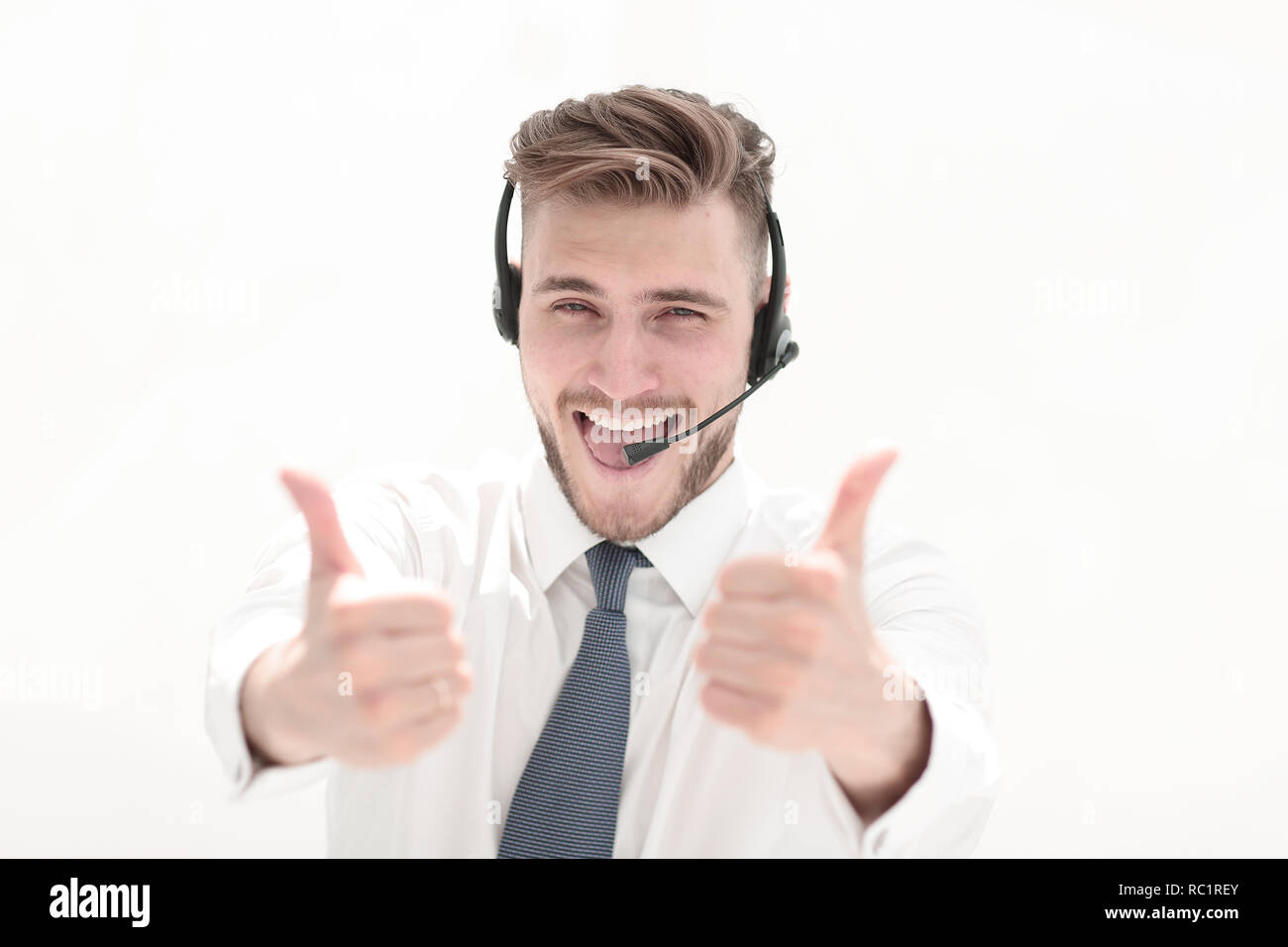 close up.smiling call center employee showing thumbs up Stock Photo - Alamy