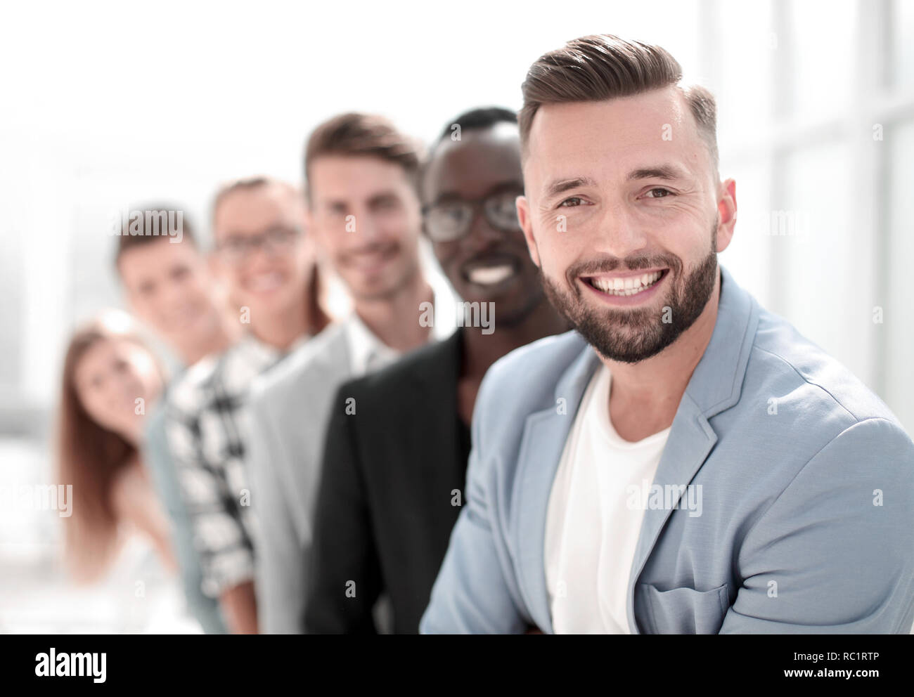 six different people standing in a row Stock Photo - Alamy