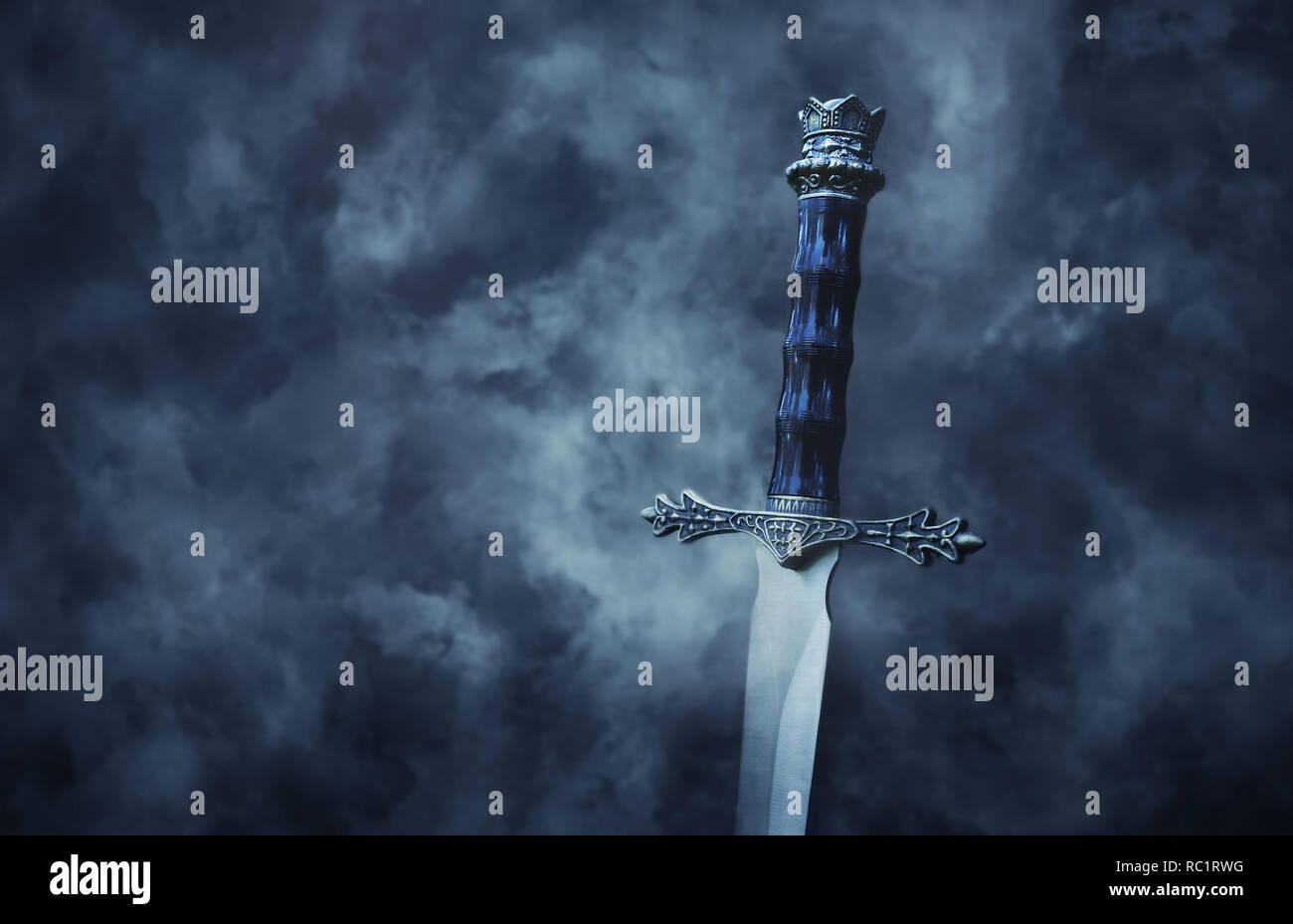mysterious and magical photo of silver sword over gothic black ...
