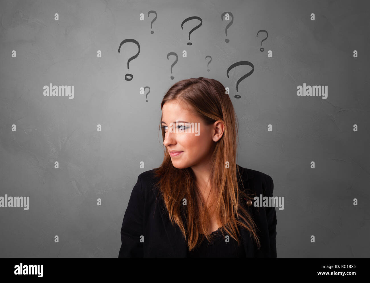 Person with question marks around face Stock Photo - Alamy