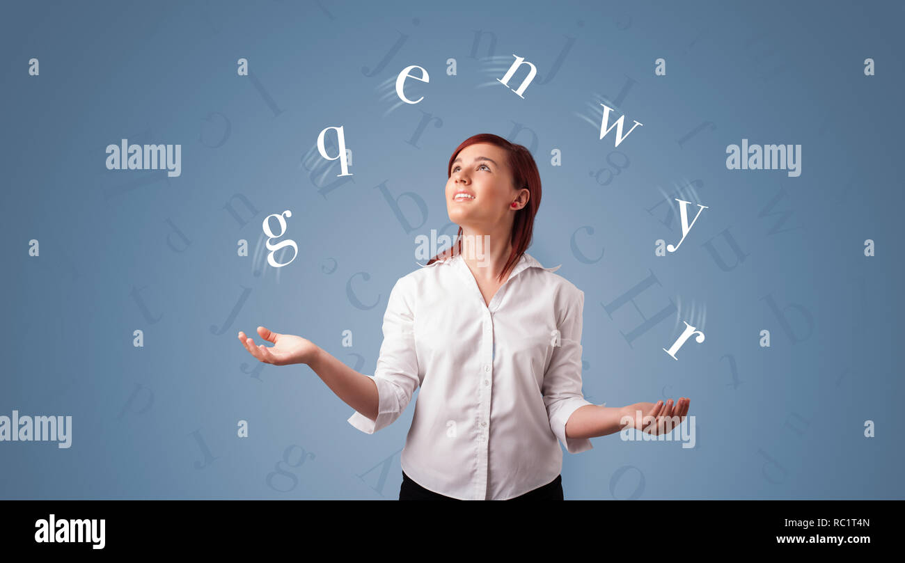 Young student juggle with letters Stock Photo - Alamy