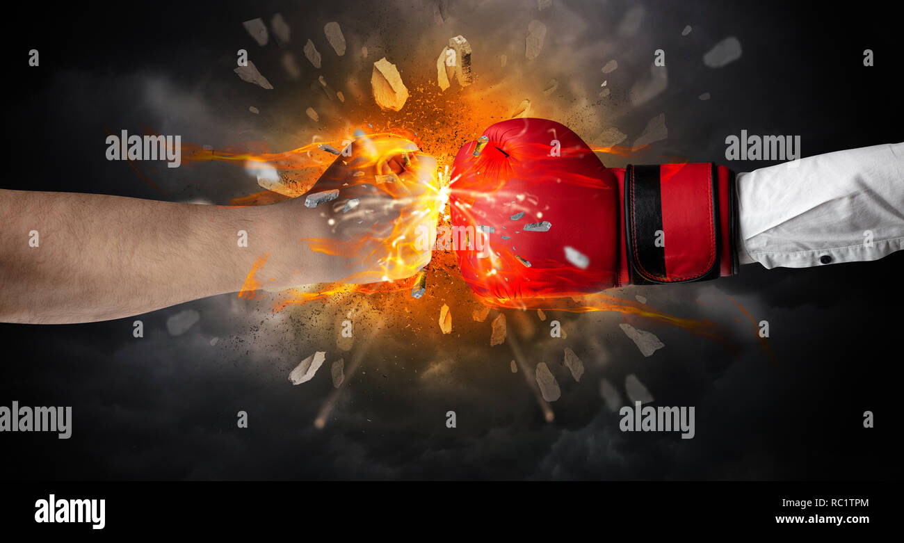 Two hands fighting and breaking a rock into small pieces Stock Photo ...