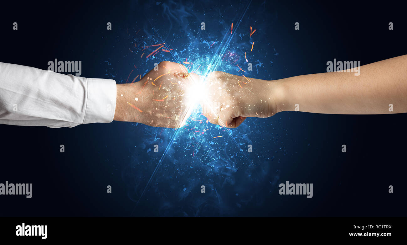 Two hands fighting with light, glow, spark and smoke concept Stock ...