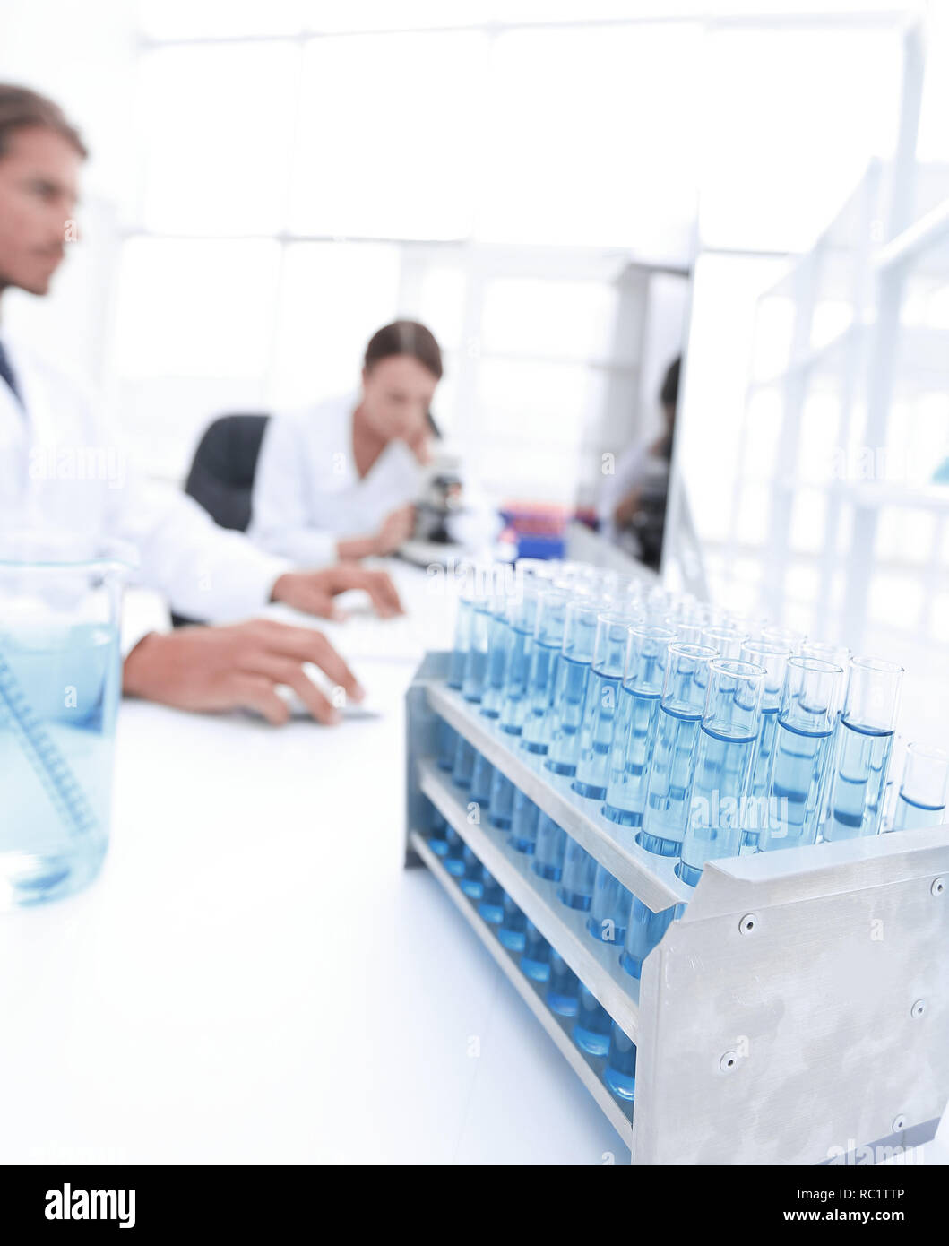 side view of scientists working in laboratory Stock Photo - Alamy