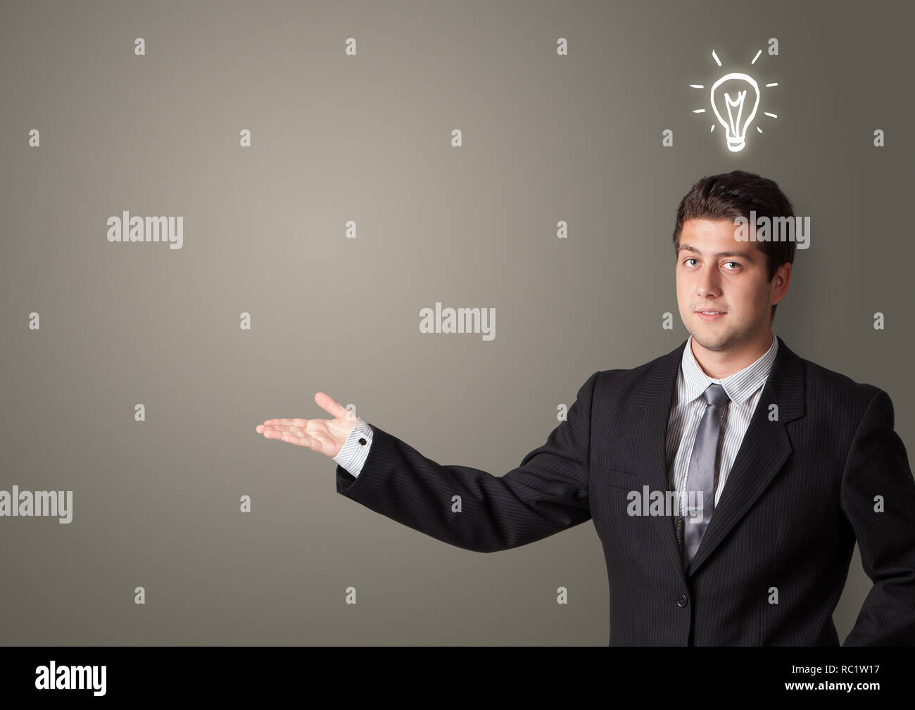 Young smiling person presenting new idea concept Stock Photo - Alamy