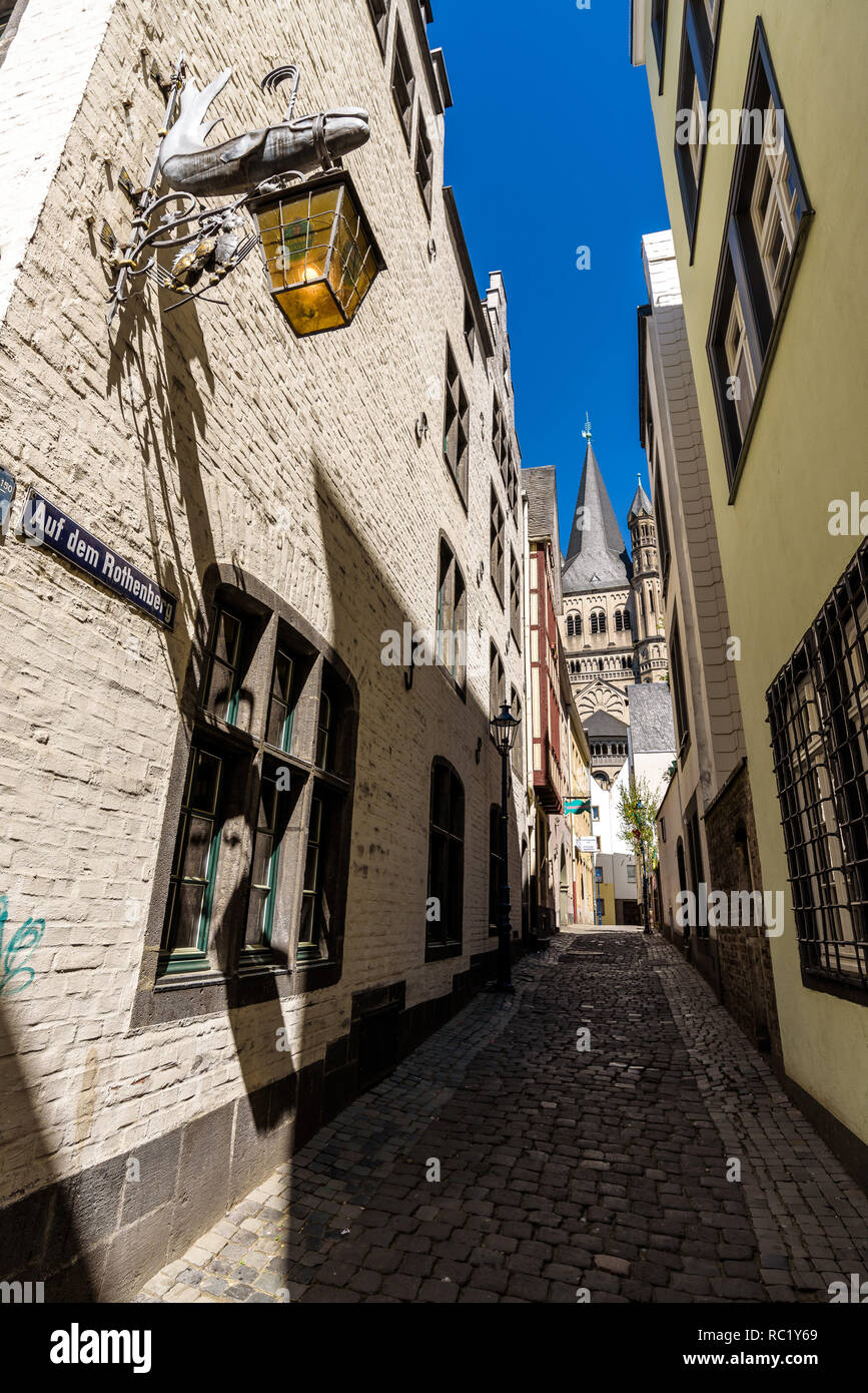Auf dem Rothenberg street in Koln, Germany. The Church of Great St ...