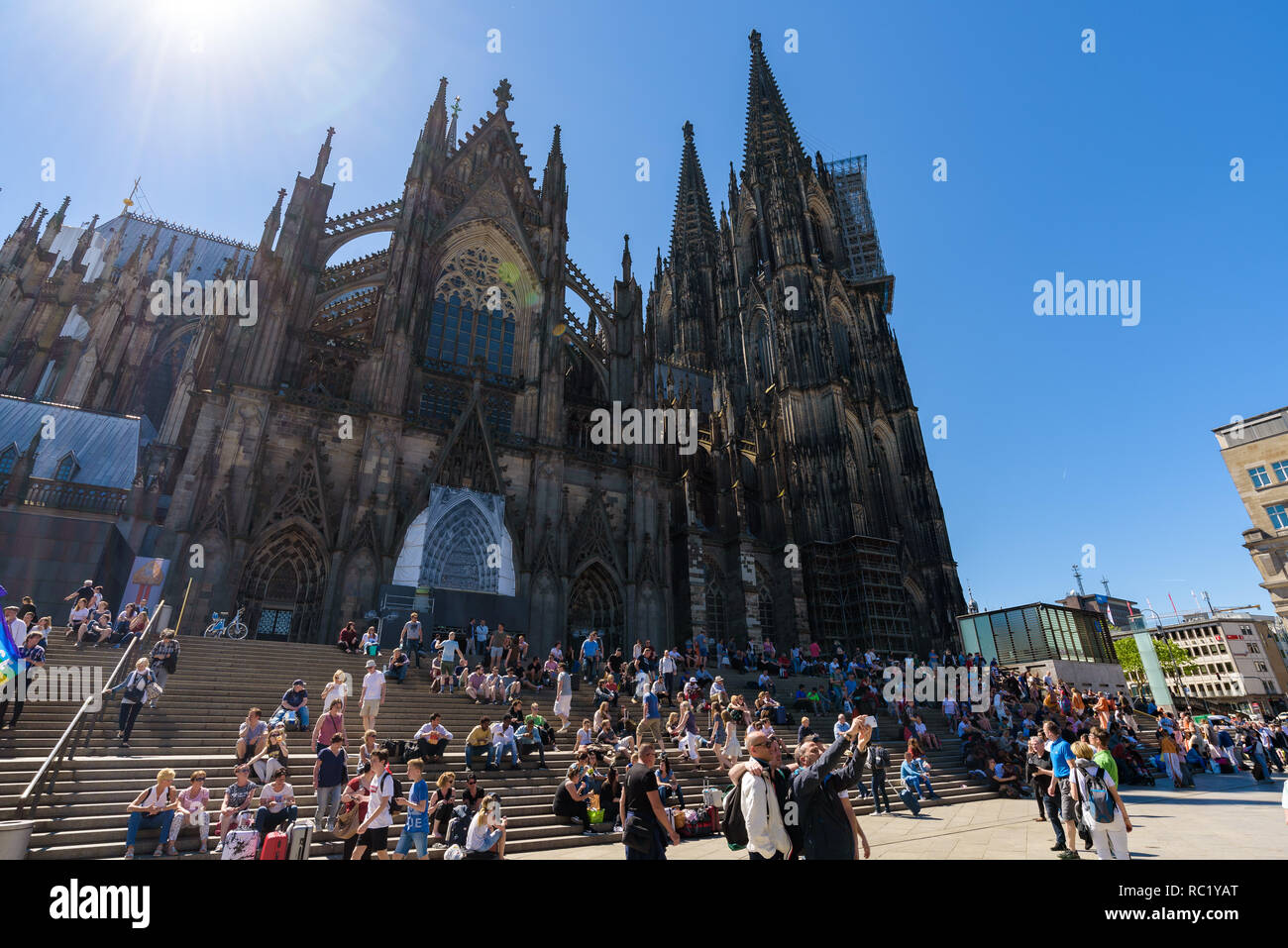 Cologne, Germany - May 2018. Local people and tourists sitting on the ...