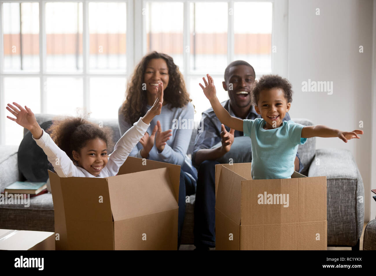 Children playing with boxes hi-res stock photography and images - Alamy
