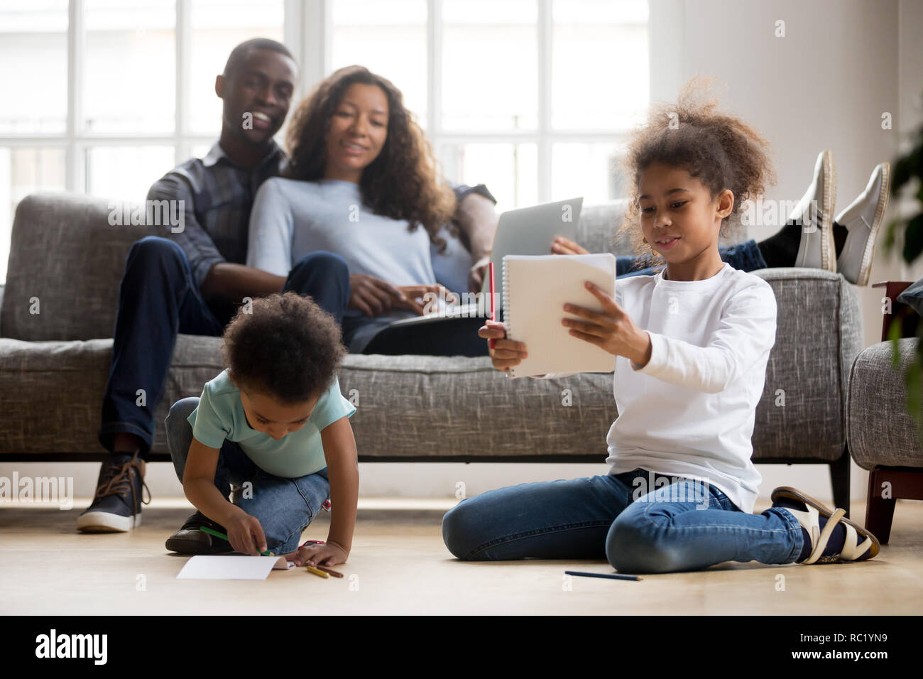 Parents play on floor hi-res stock photography and images - Alamy
