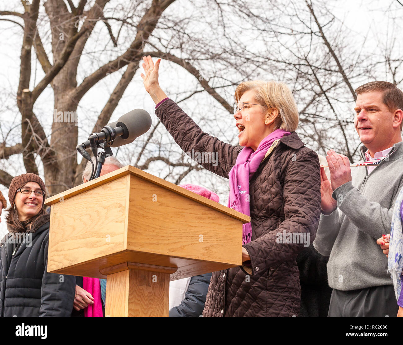 Senator Elizabeth Warren raising her hand and yelling encouragement to ...