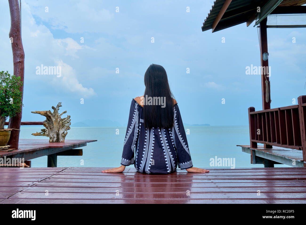 Beautiful woman posing - sitting back view, enjoying and relaxing Stock ...