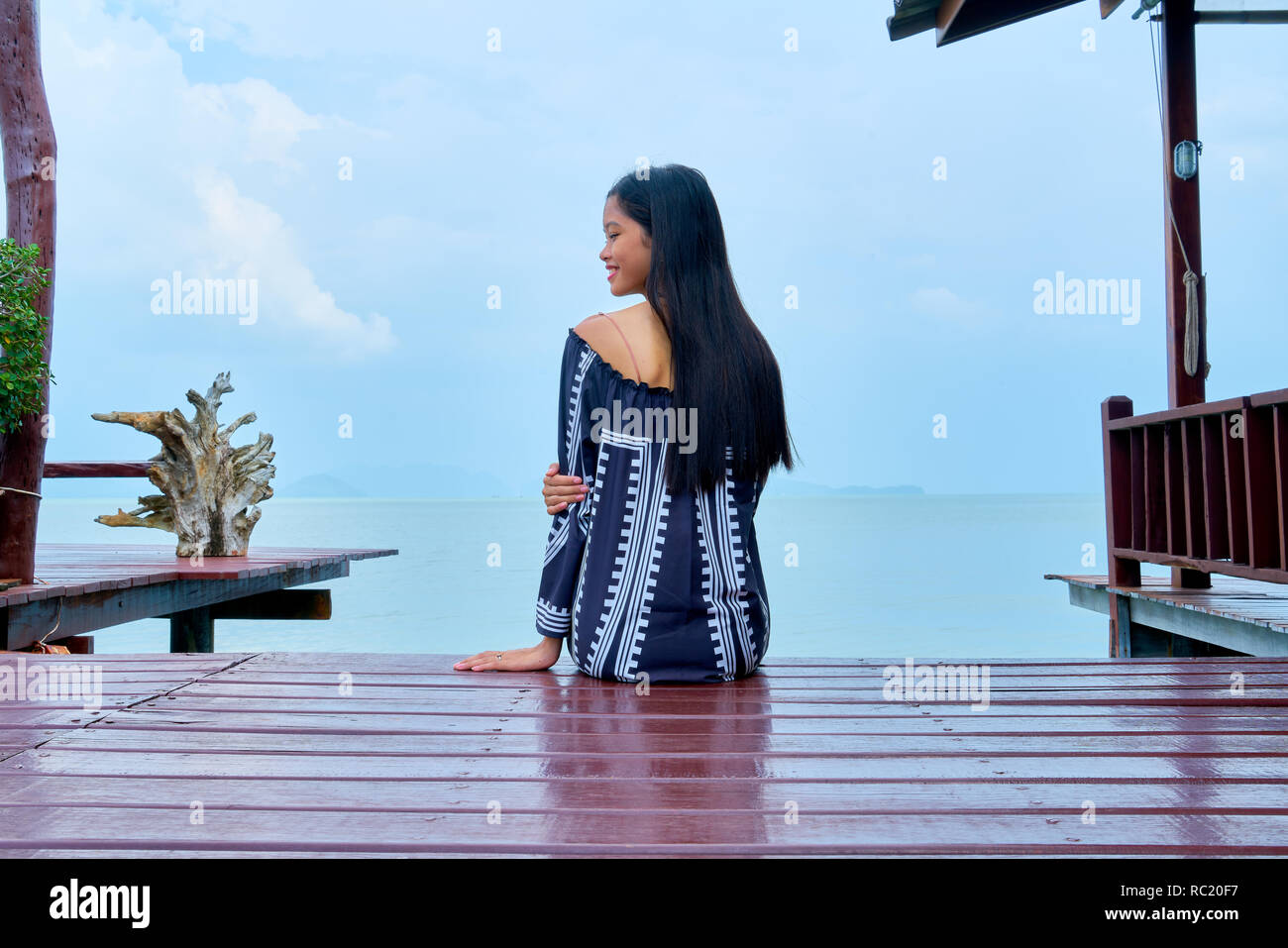 Beautiful woman posing - sitting back view, enjoying, smile and ...