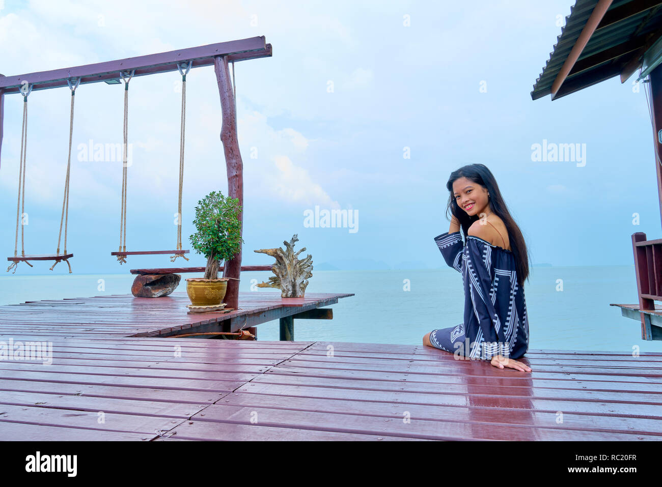 Beautiful woman posing - sitting back view, enjoying the view and ...