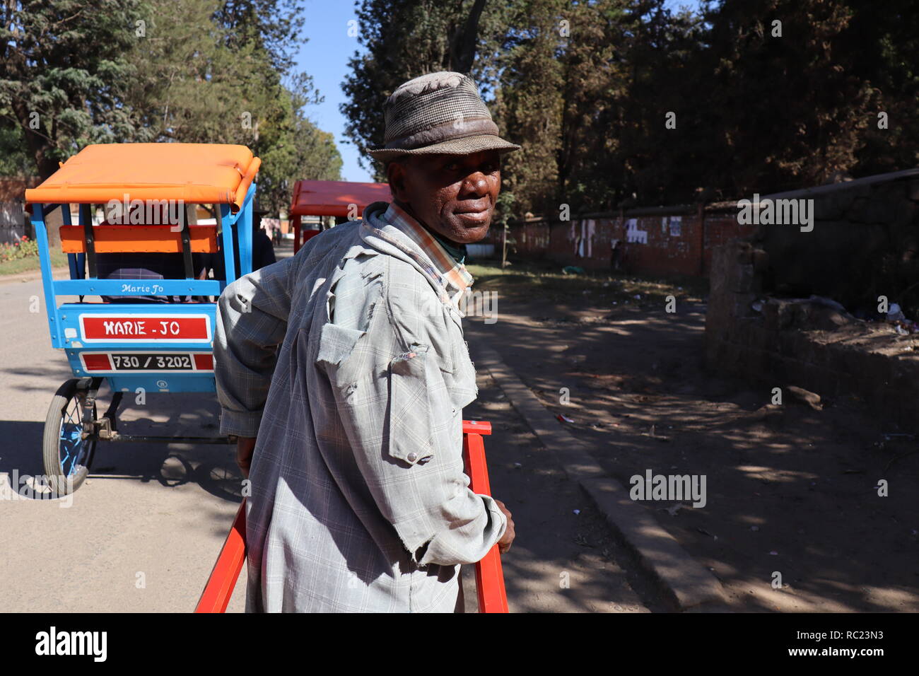 Rickshaw runner in Antsirabe, Madagascar Stock Photo - Alamy