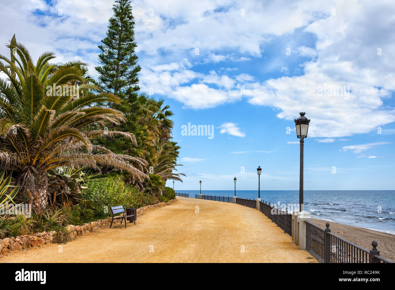 Marbella promenade on Costa del Sol with lamp post along the sea in ...