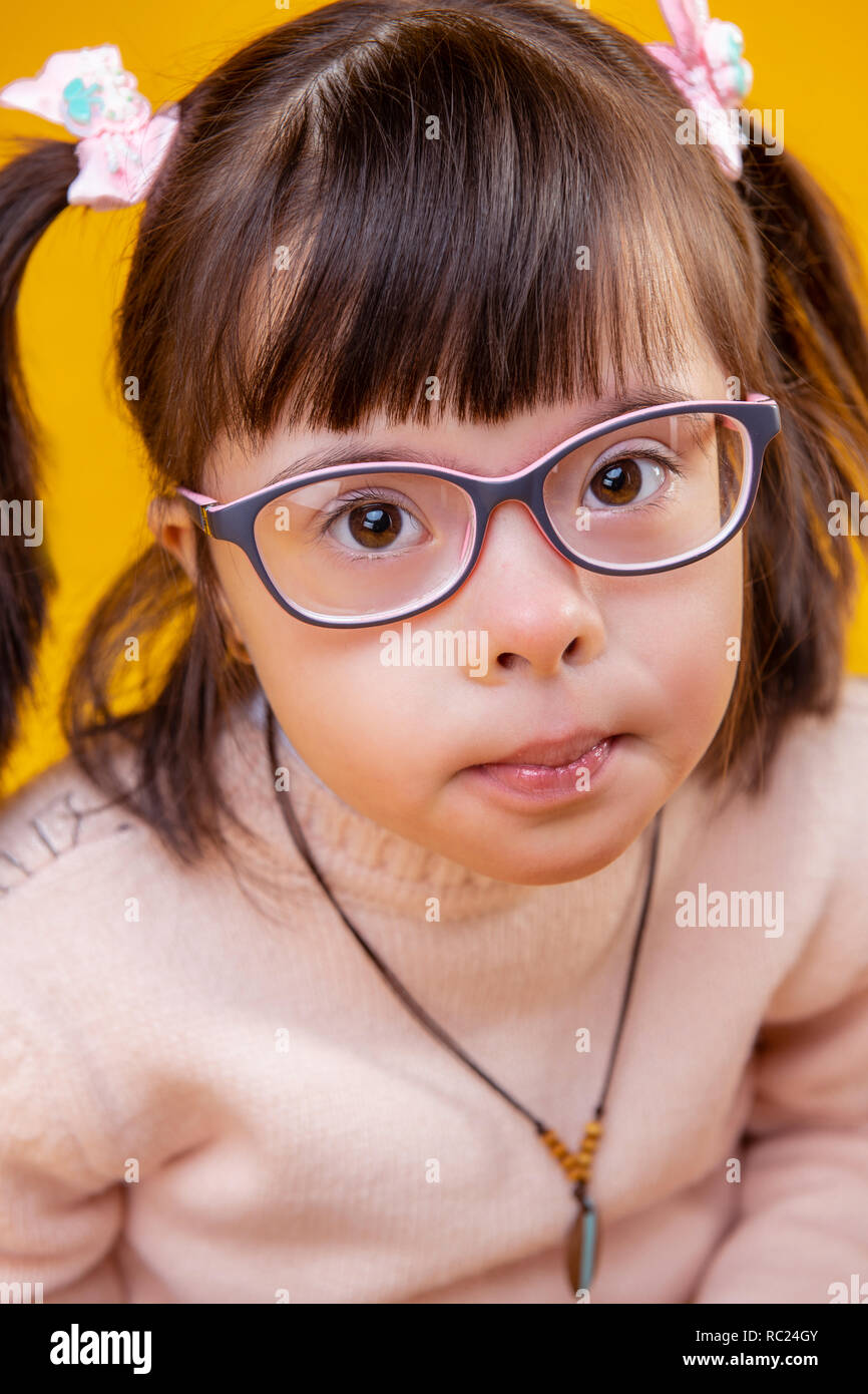 Pretty little lady with big brown eyes posing for cameramen Stock Photo ...