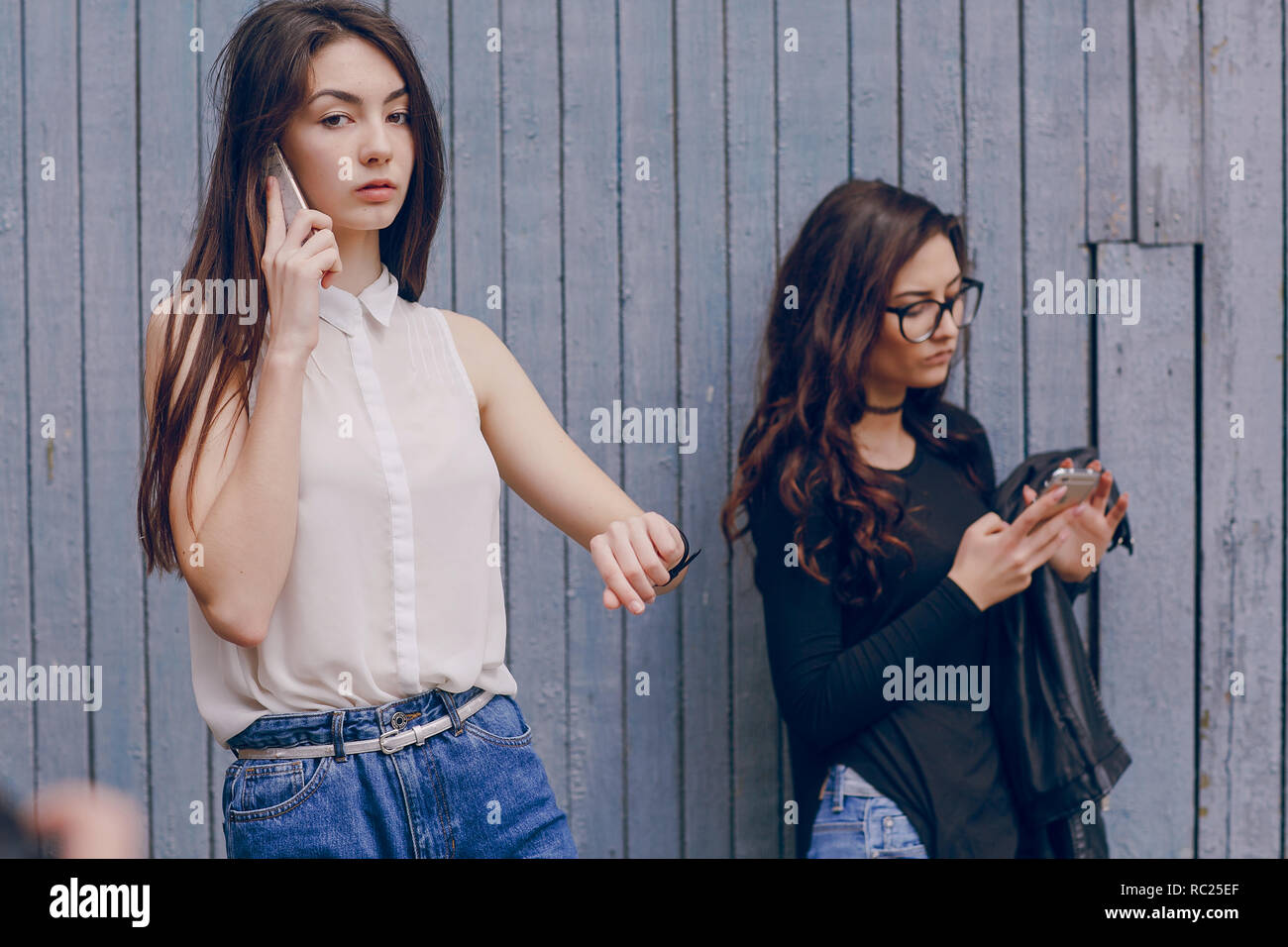 stylish young model walk in the street and pose for a photo on a Sunny ...