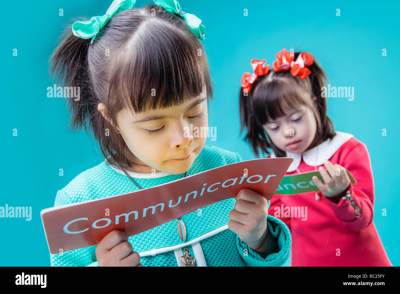 Dark-haired interested girls holding posters with important messages ...