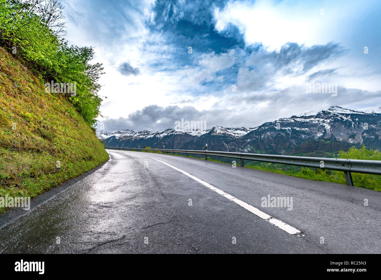 Road in Swiss Alps Stock Photo - Alamy