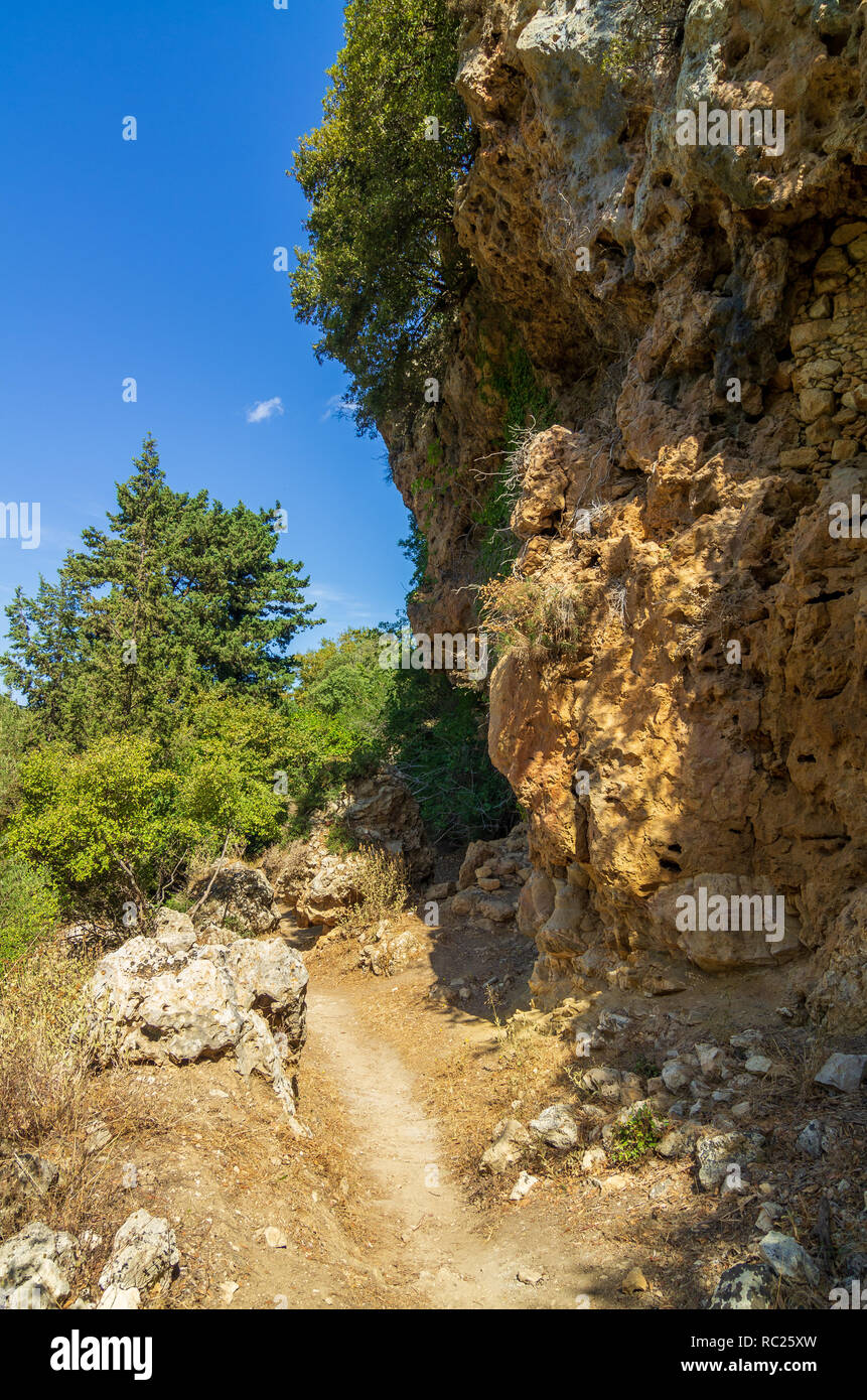 Hiking trail along a steep mountain slope on Crete, Greece Stock Photo ...